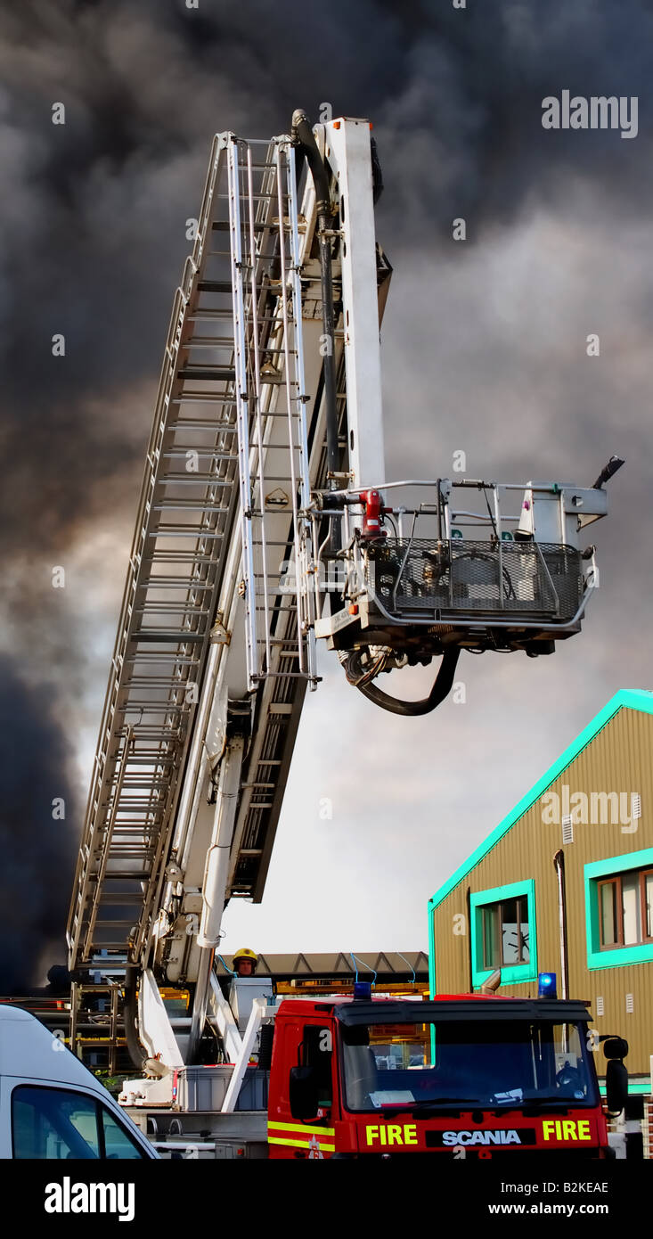 A fire crew battling a blaze Stock Photo - Alamy