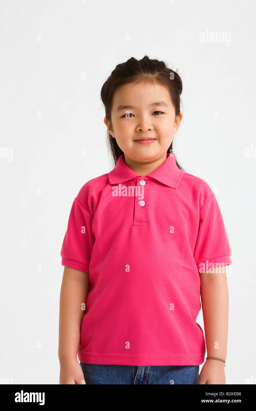 Portrait of a girl standing and smiling Stock Photo - Alamy