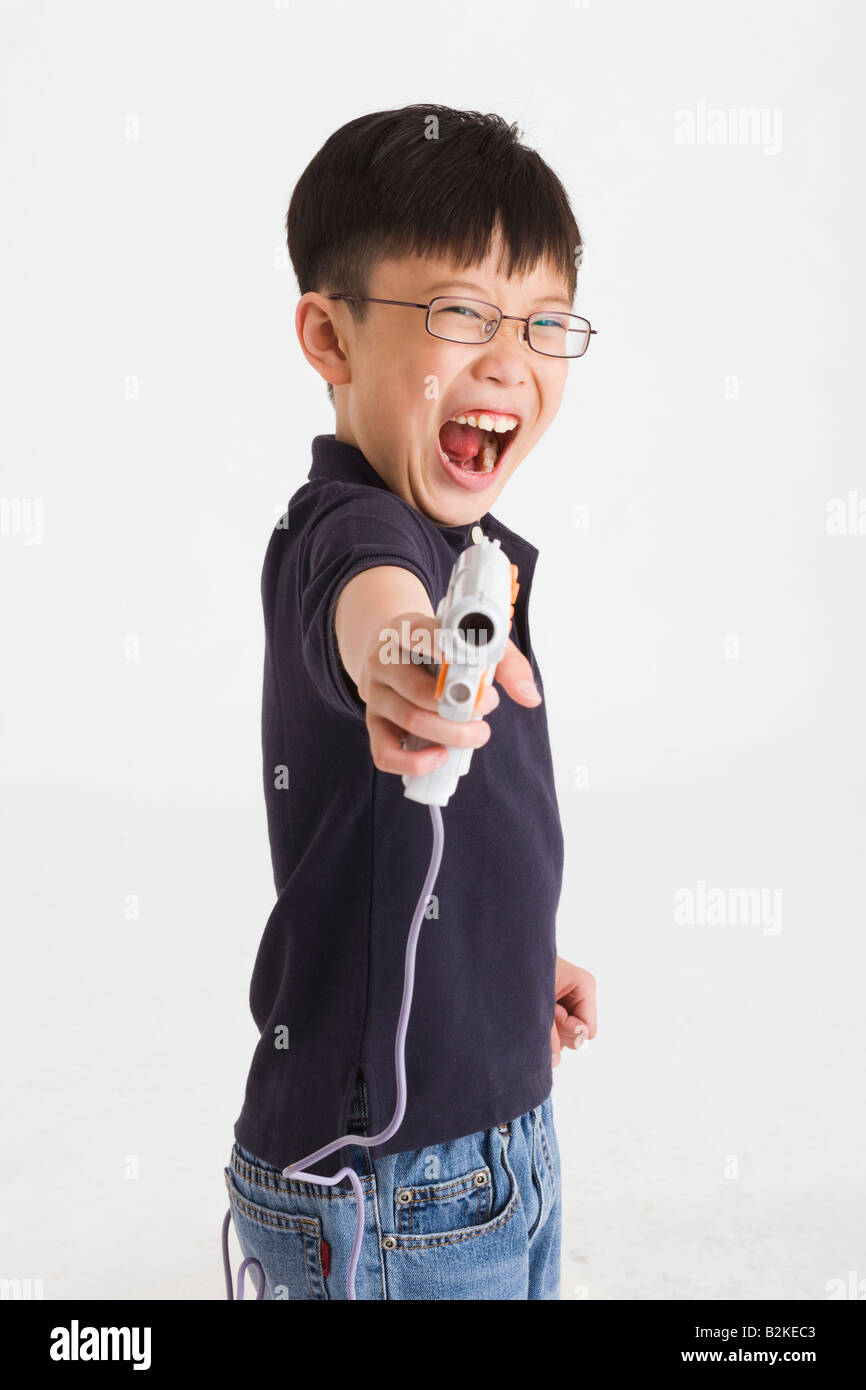 Boy playing shooting video game hi-res stock photography and images - Alamy