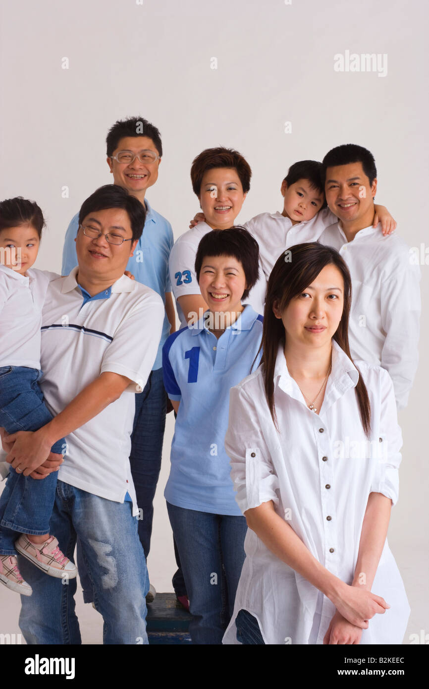 Portrait of three mid adult couples with their children Stock Photo - Alamy