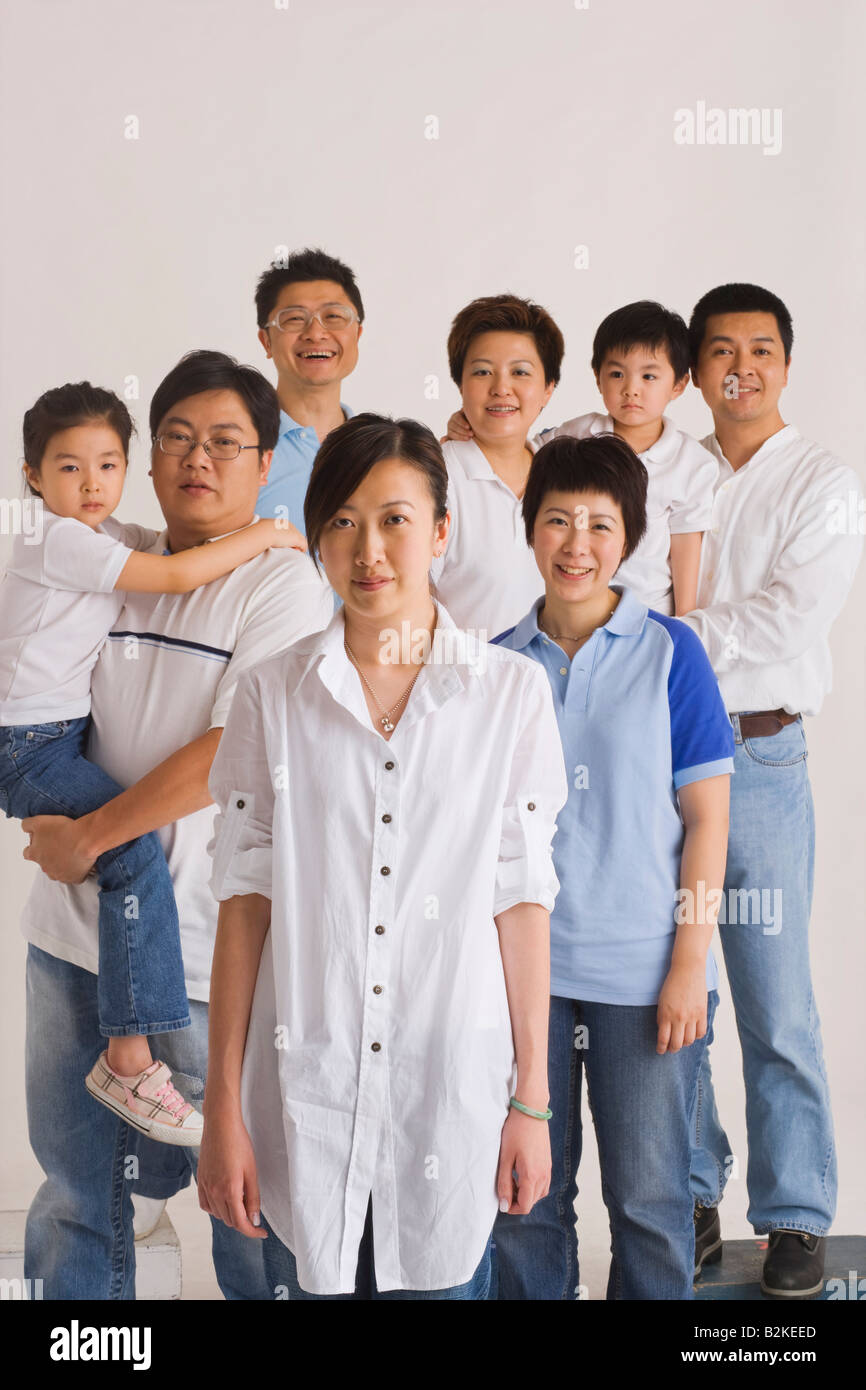 Portrait of three mid adult couples with their children Stock Photo - Alamy