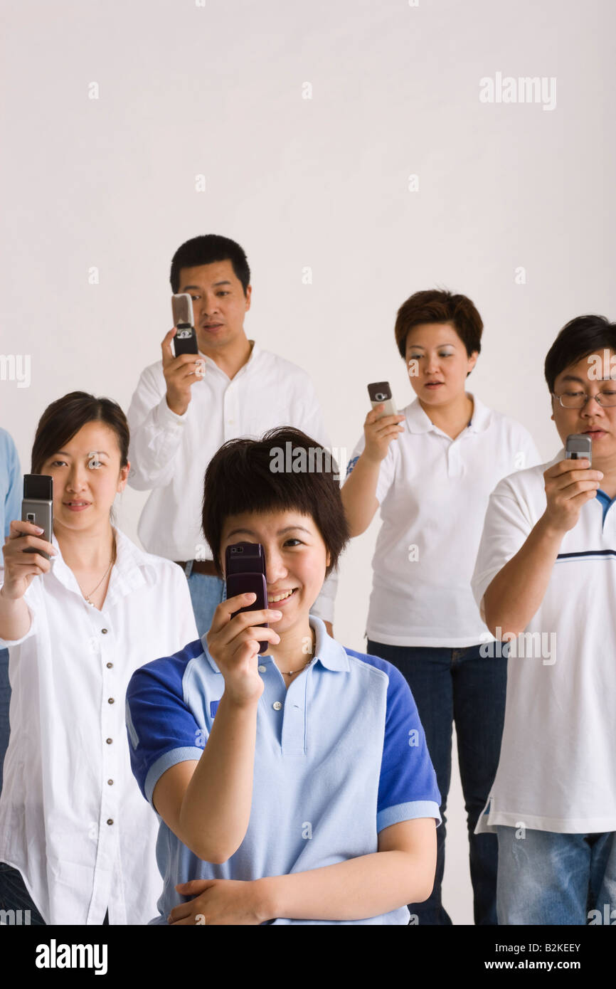 Five people using mobile phones Stock Photo - Alamy