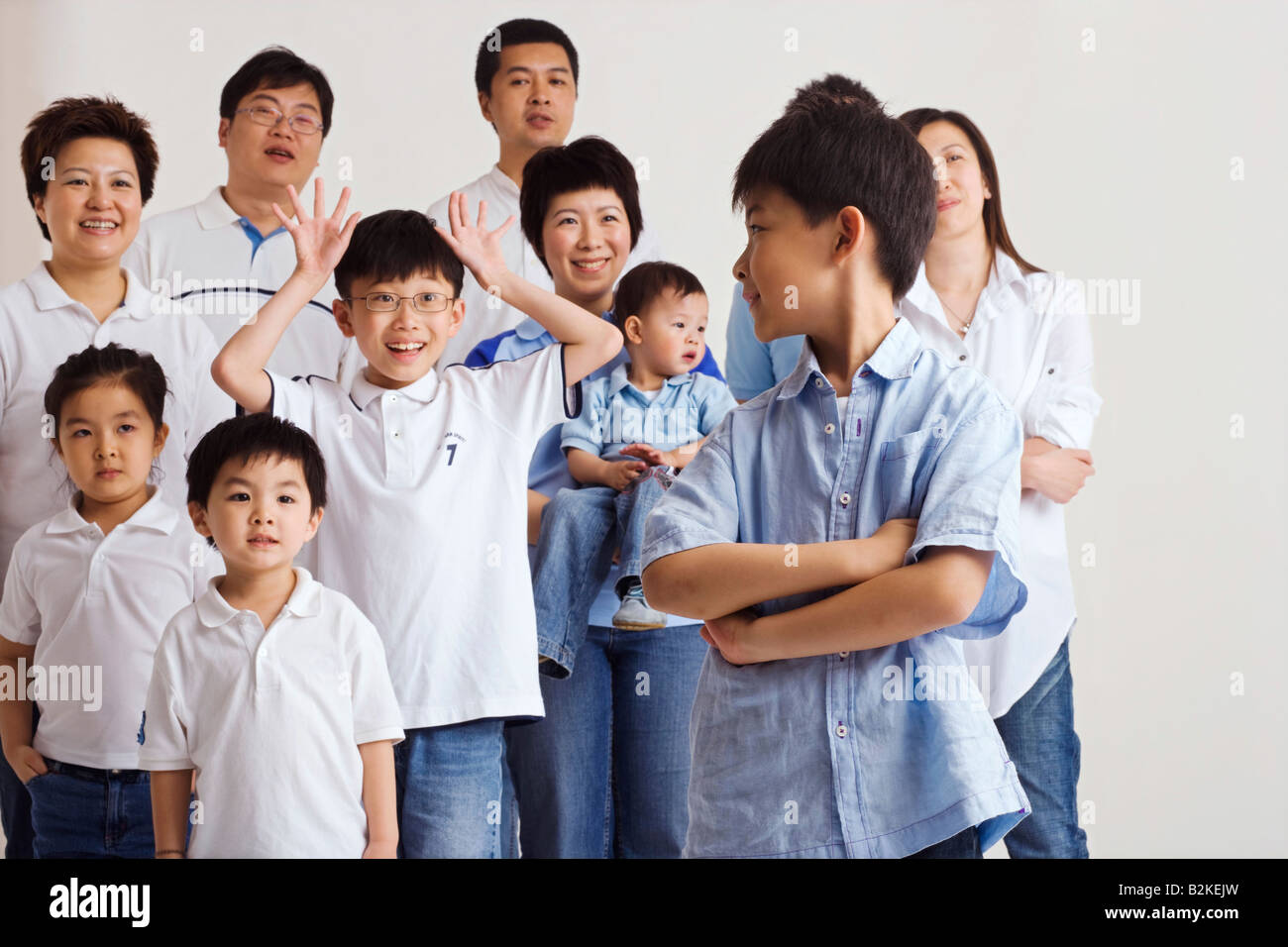 Portrait of three mid adult couples with their children Stock Photo - Alamy