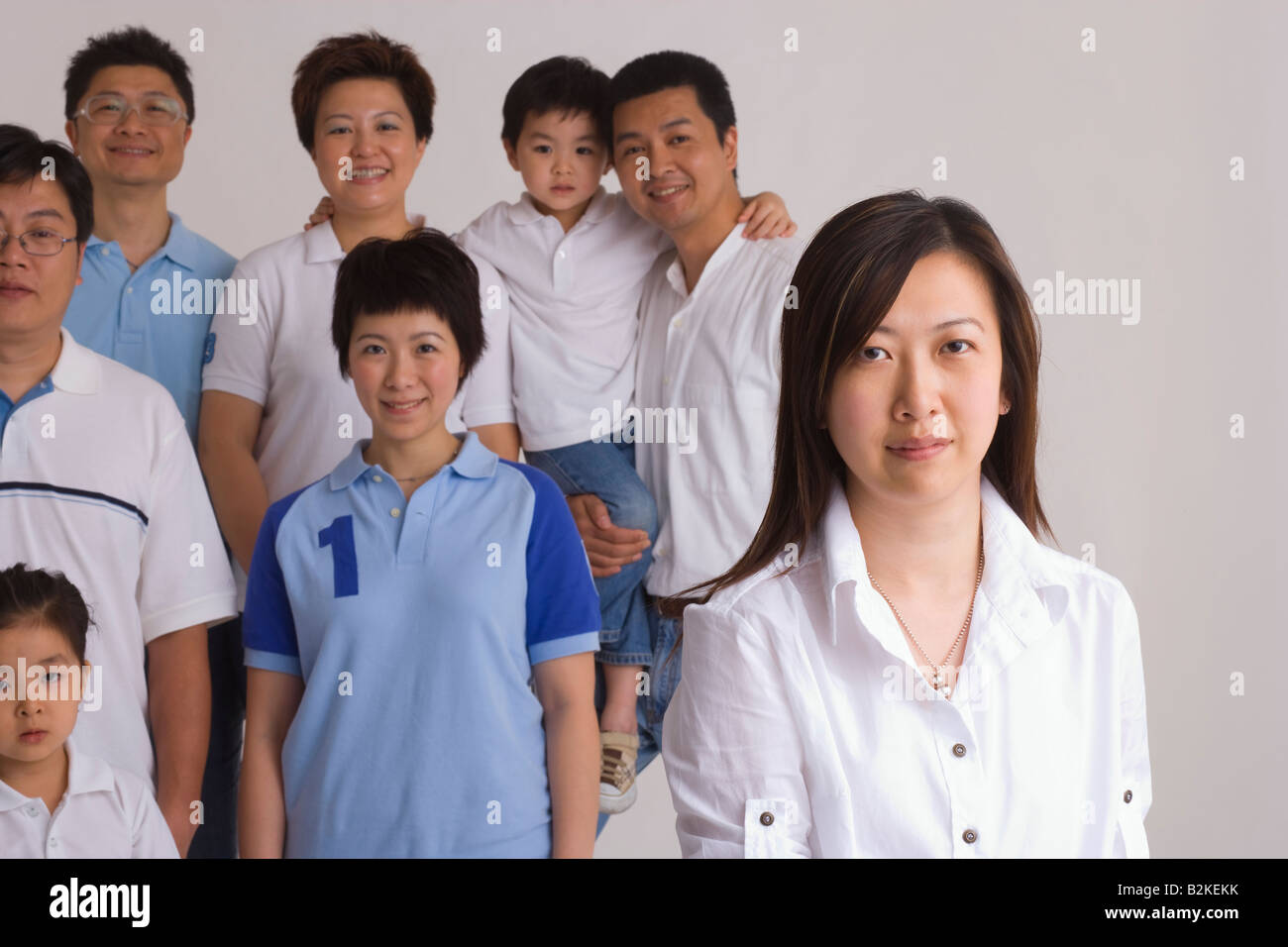 Portrait of three mid adult couples with their children Stock Photo - Alamy