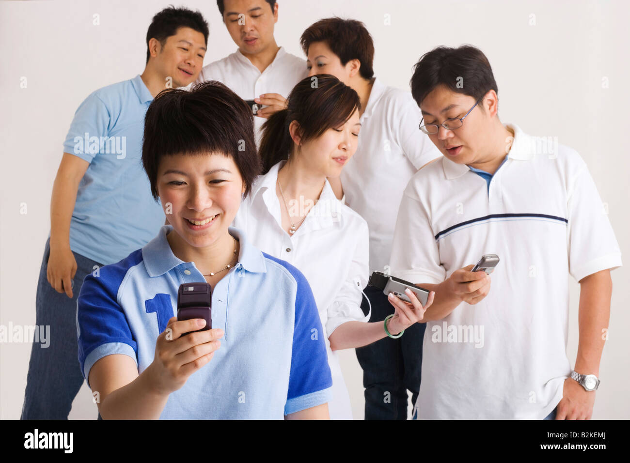 Group of people using mobile phones Stock Photo - Alamy