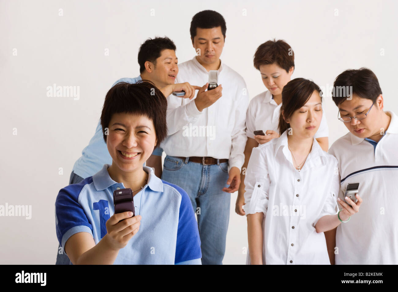 Group of people using mobile phones Stock Photo - Alamy