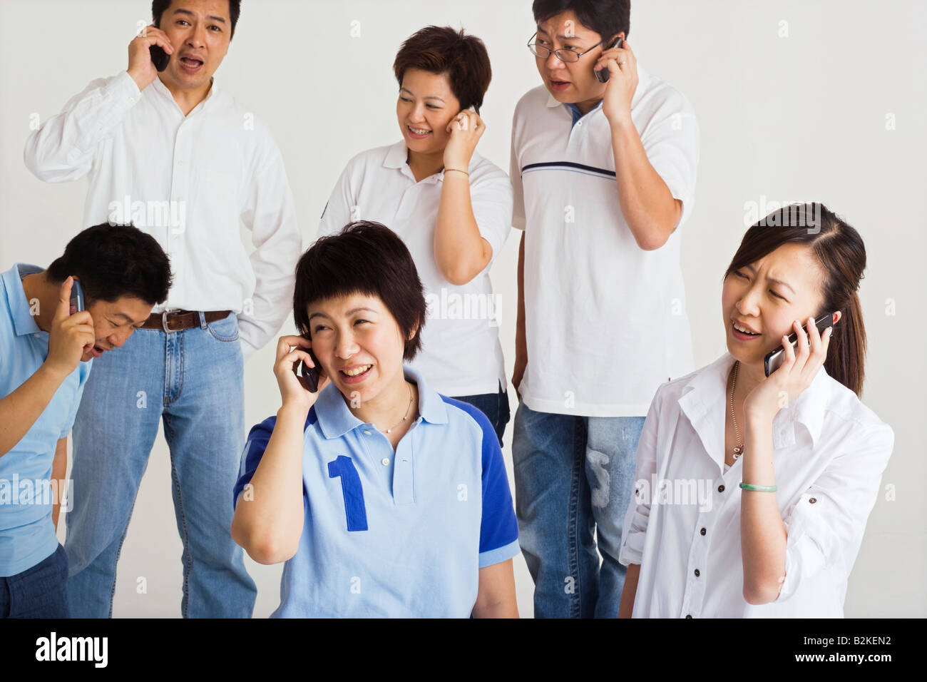 Group of people talking on mobile phones Stock Photo - Alamy