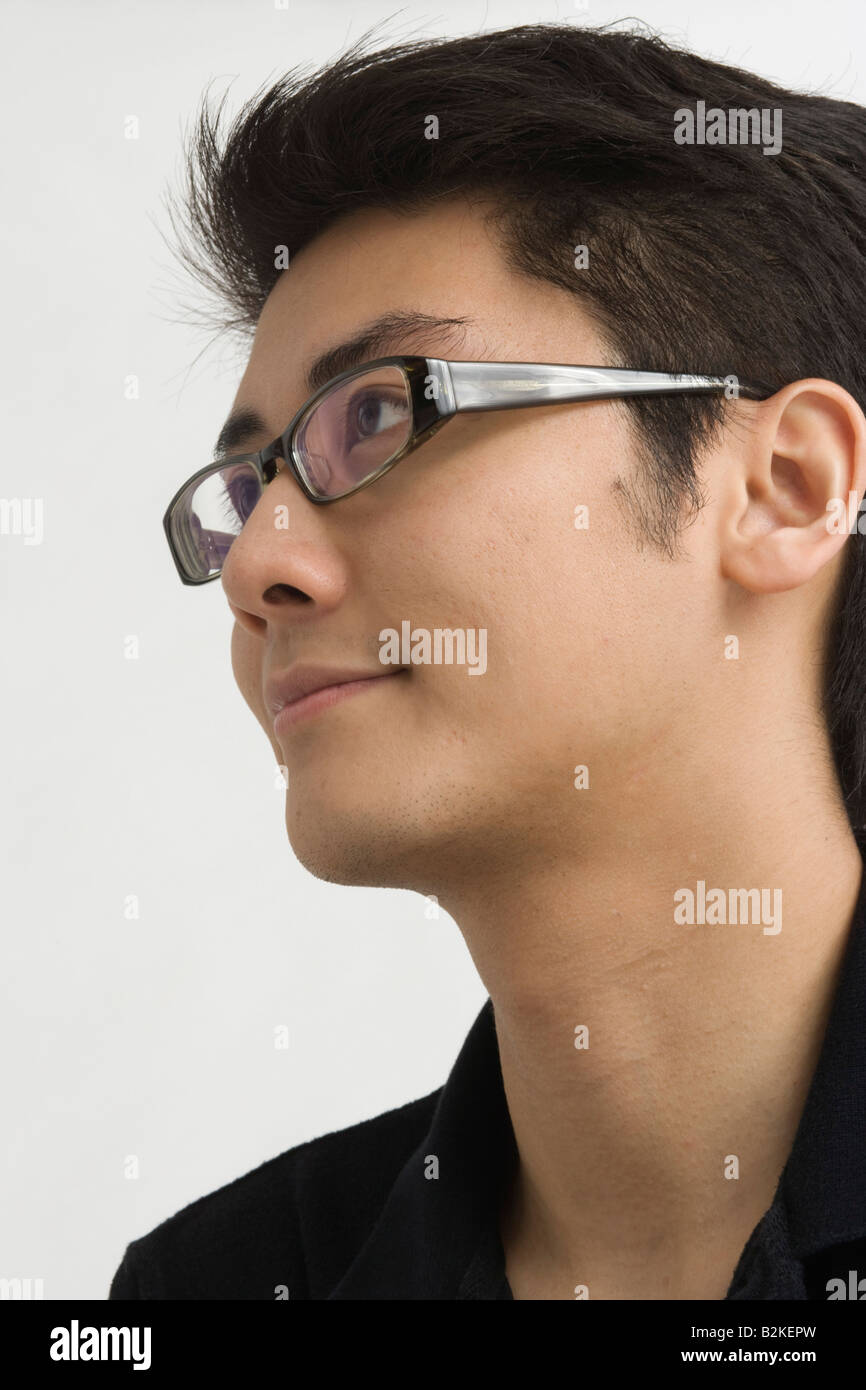 Close-up of a young man smiling Stock Photo - Alamy