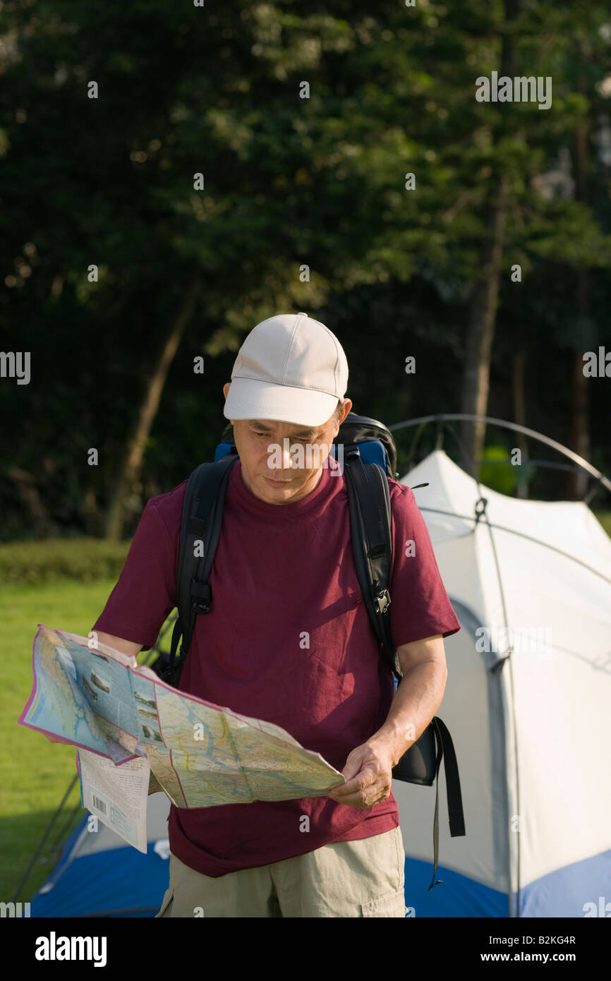 Mature man looking at a map Stock Photo - Alamy