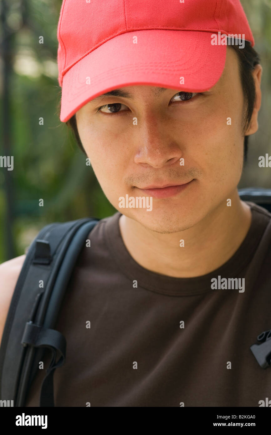 Portrait of a young man wearing a cap and smiling Stock Photo - Alamy