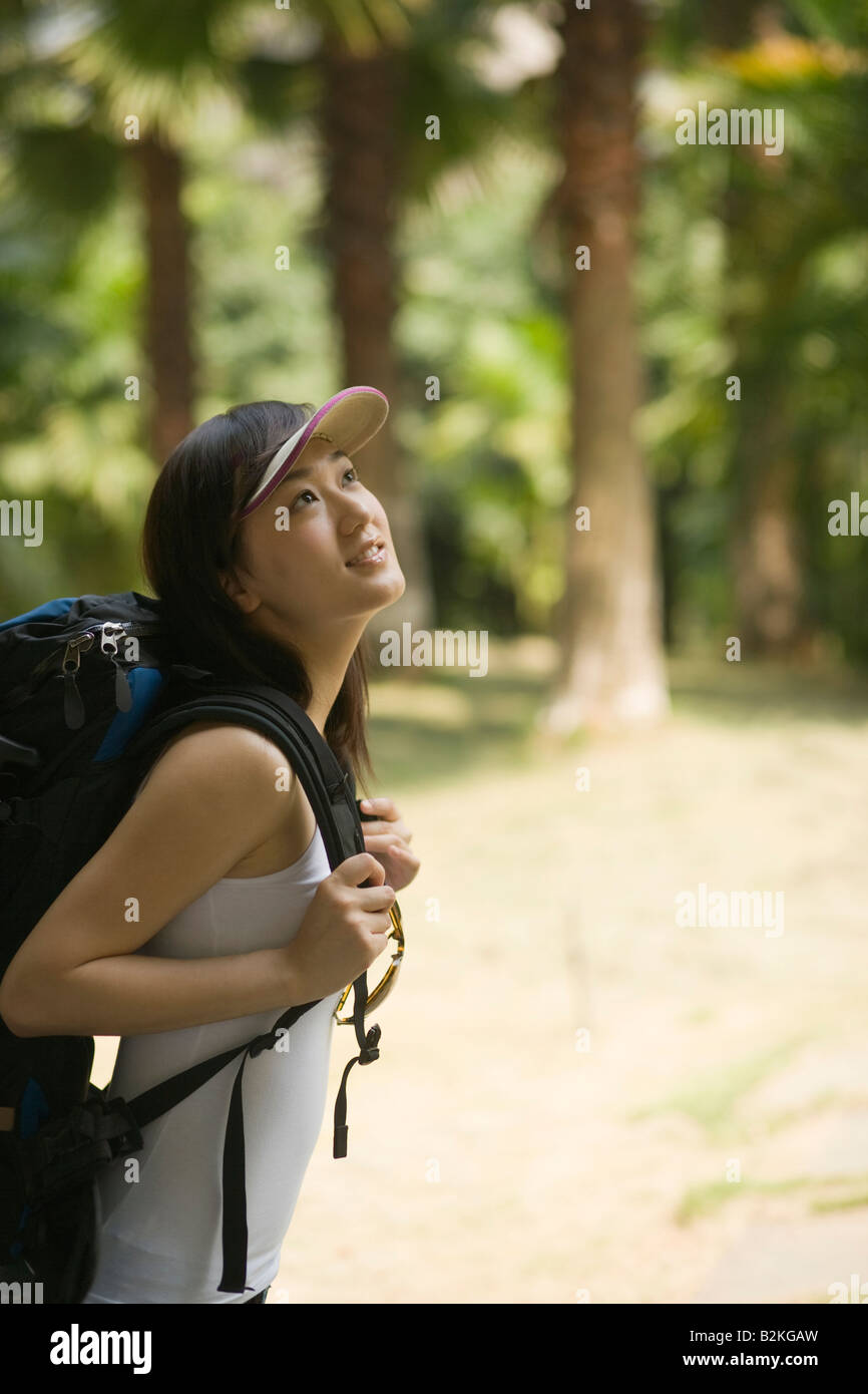 Side profile of a young woman carrying a bag and smiling Stock Photo ...