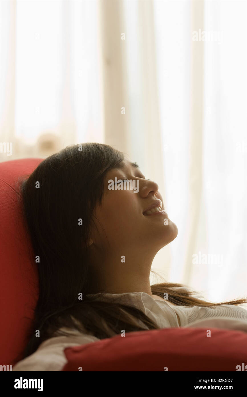 One woman eyes closed smiling daydream hi-res stock photography and ...
