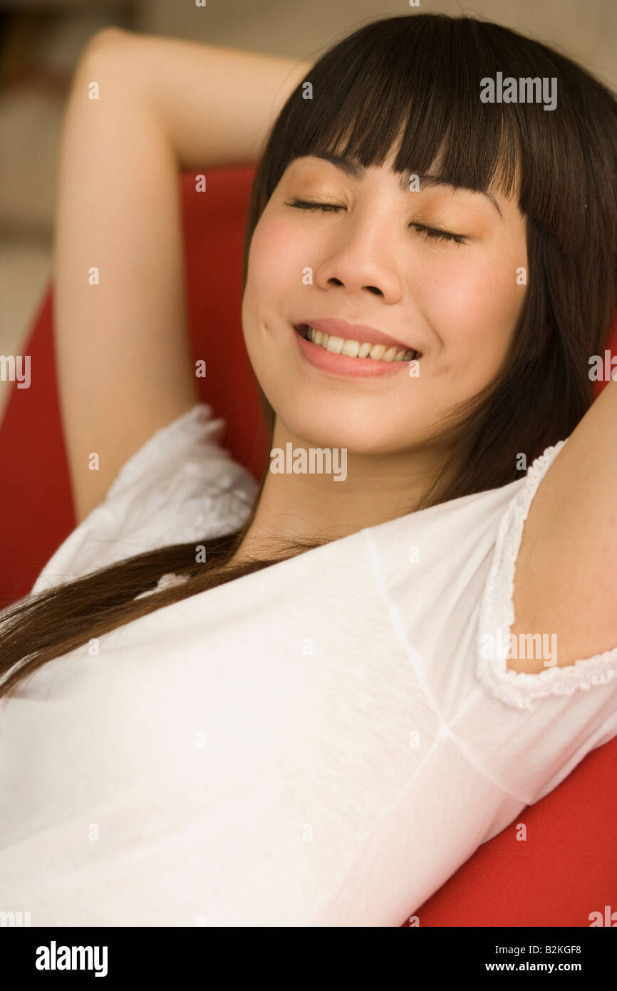 One woman eyes closed smiling daydream hi-res stock photography and ...