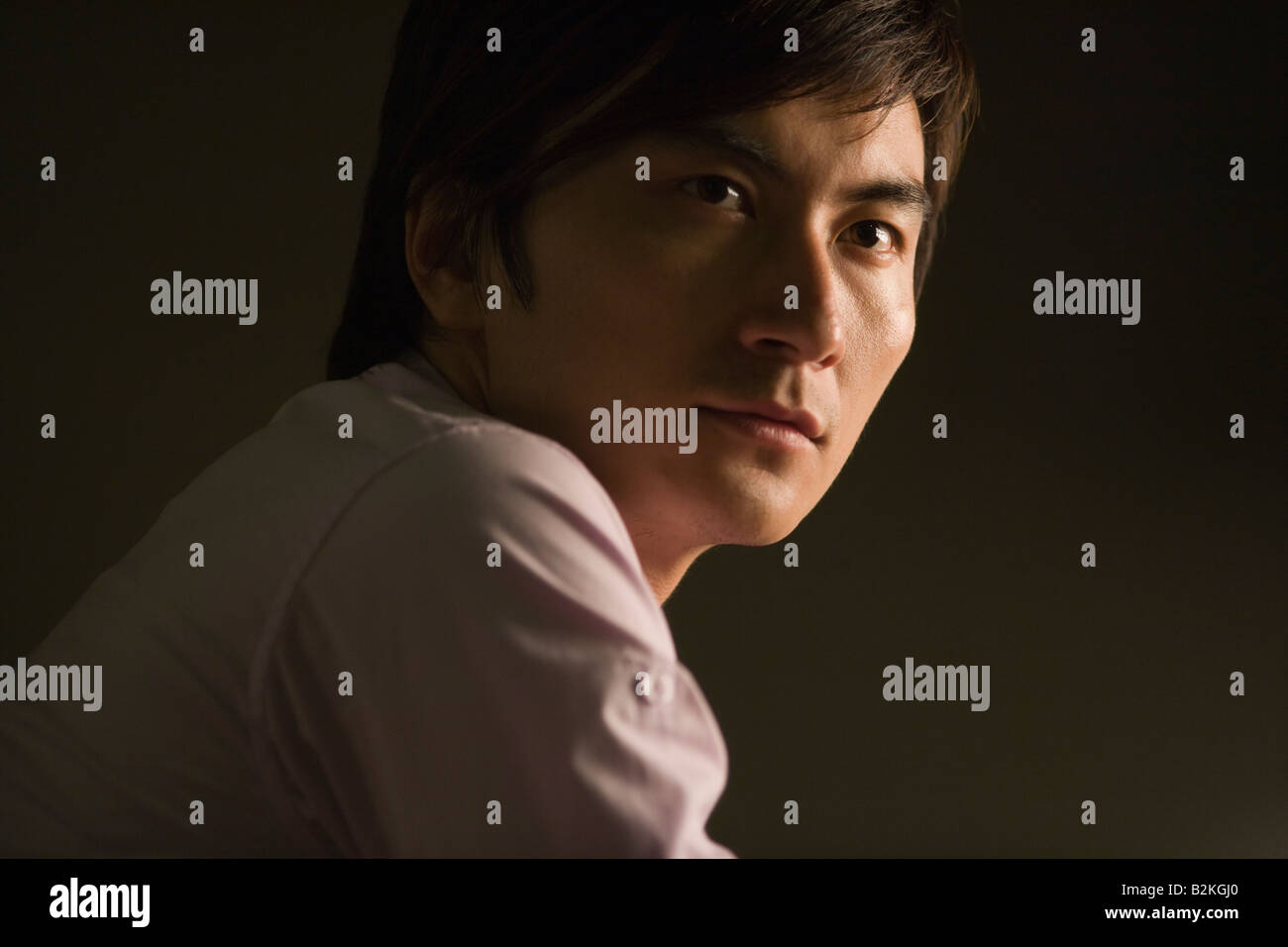 Close-up of a young man staring Stock Photo - Alamy