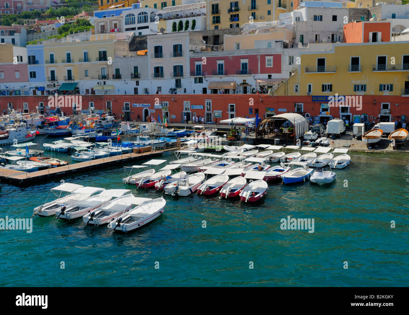 A fine view to Ponza harbour, a crystal water and the typical colorful ...