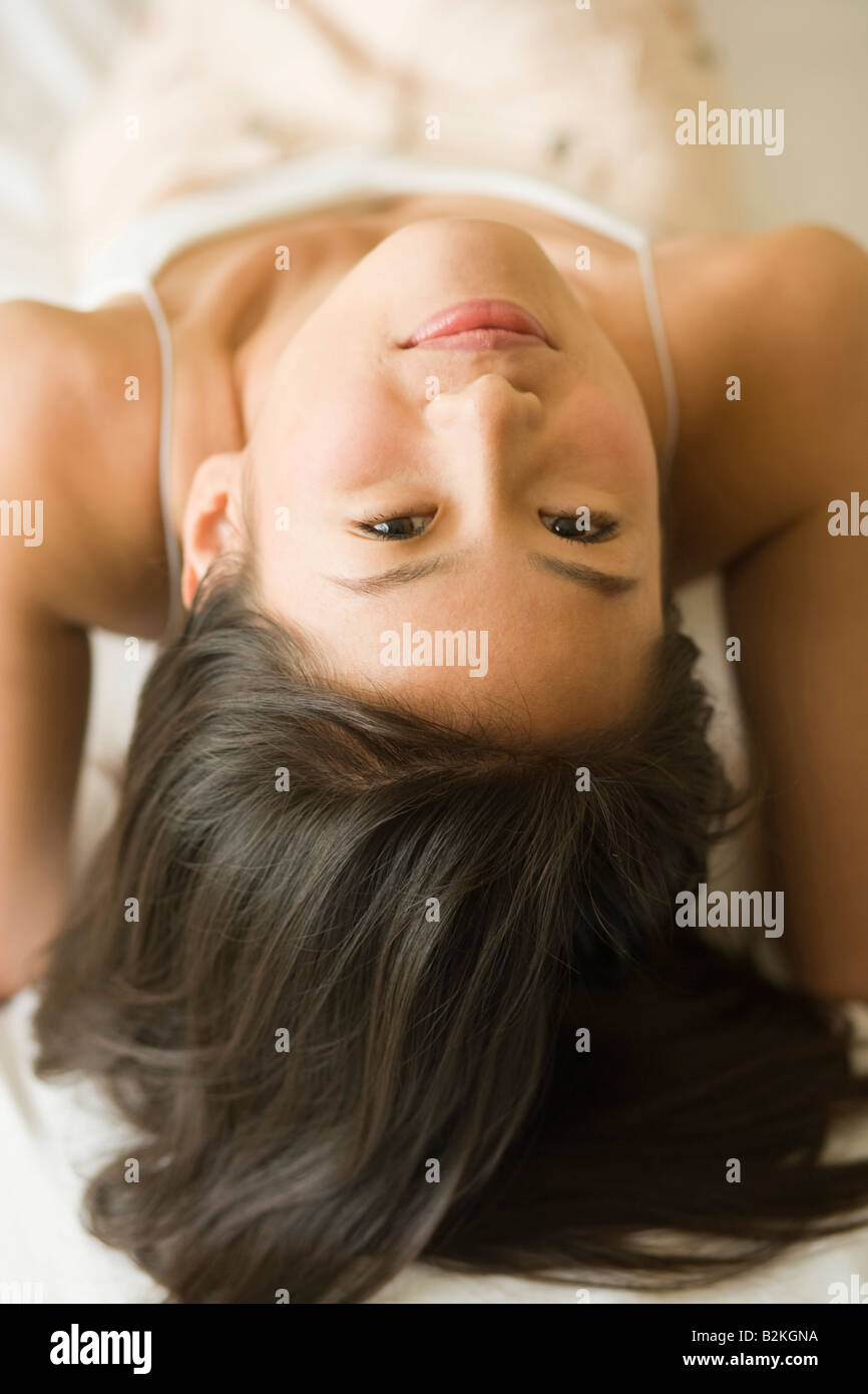 Beautiful woman reclining on bed hi-res stock photography and images ...