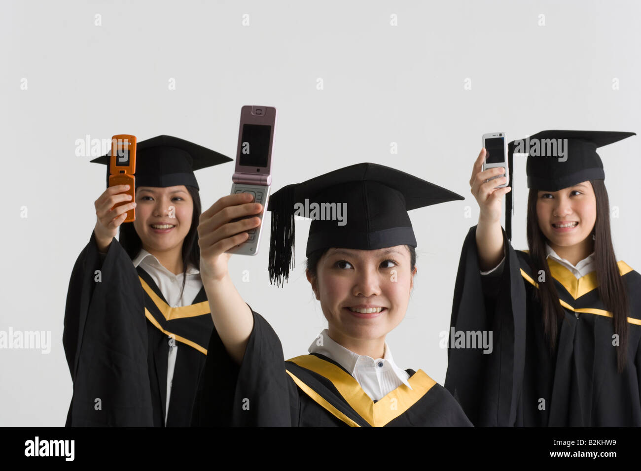 Three female graduate students photographing themselves Stock Photo - Alamy