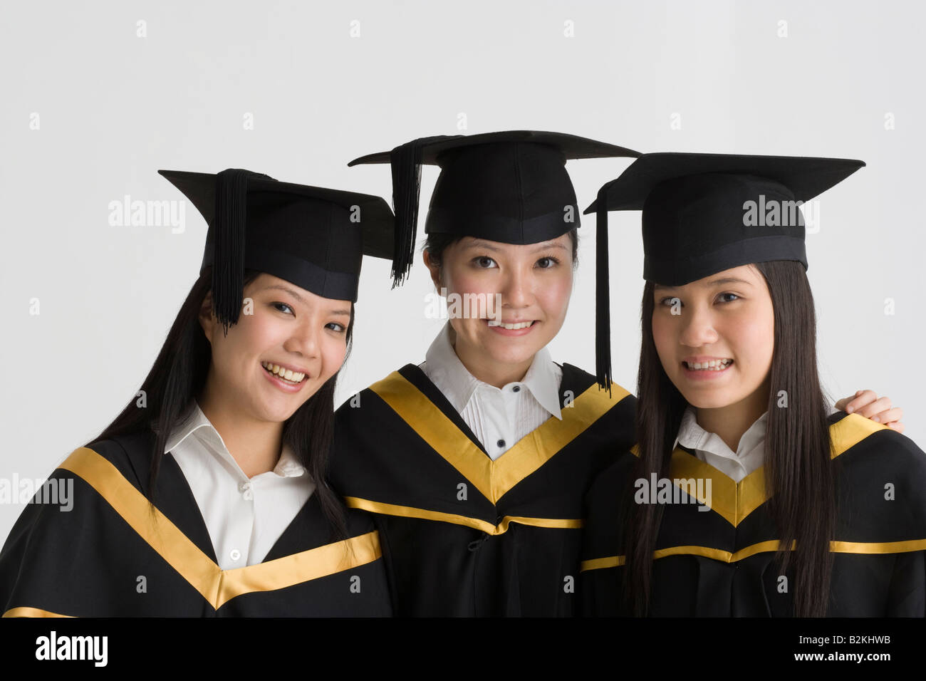 Portrait of three female graduate students smiling together Stock Photo ...