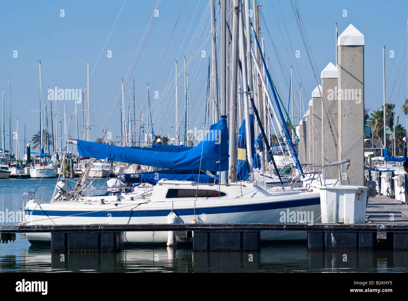 row of sailboats in a small harbor Stock Photo - Alamy