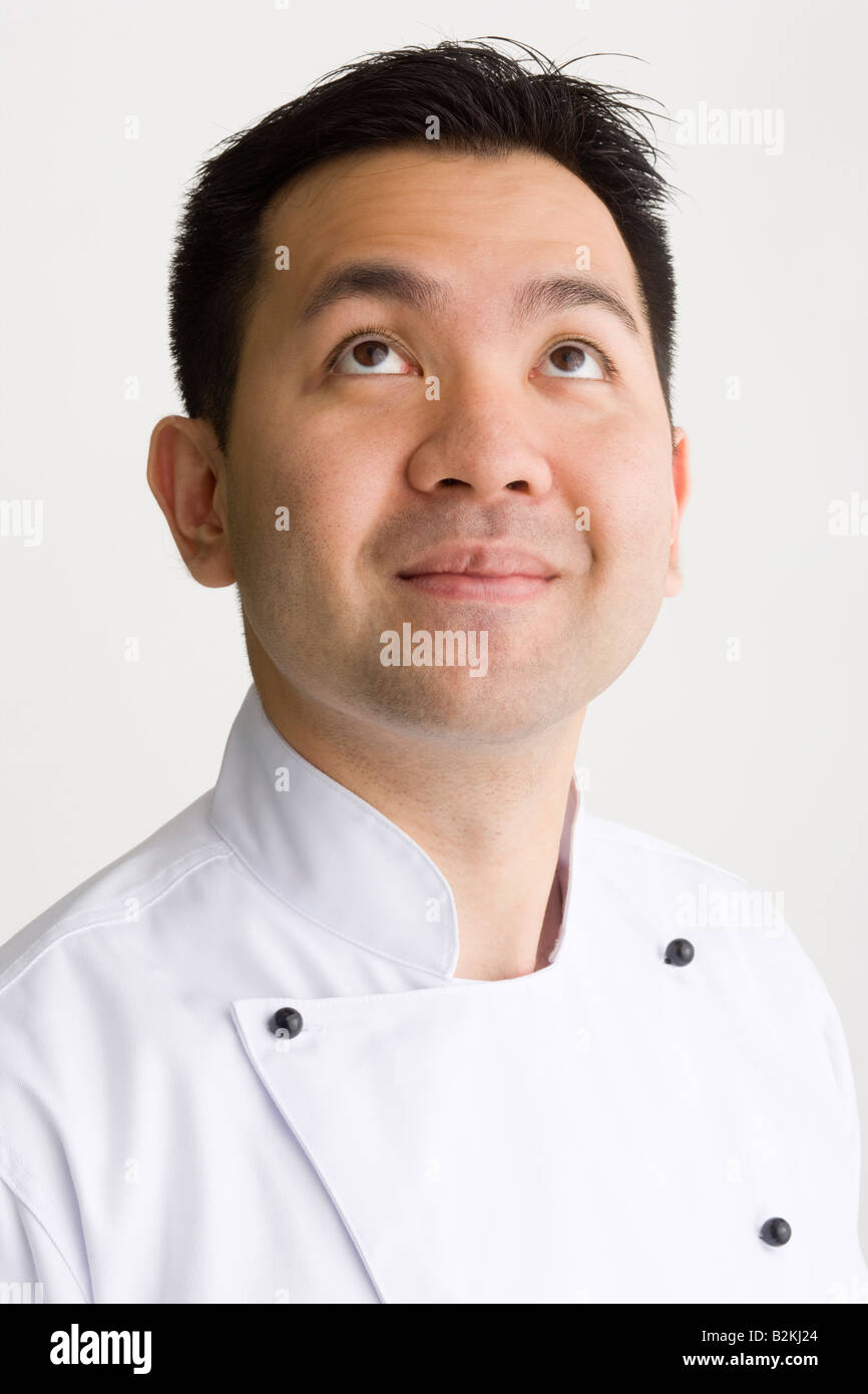 Close-up of a male chef thinking Stock Photo - Alamy