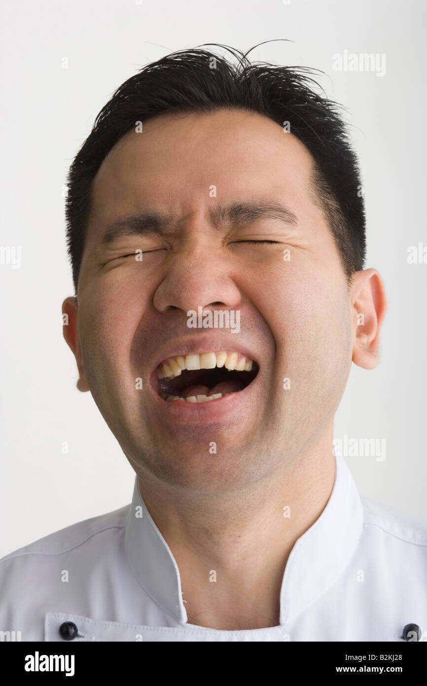 Close-up of a male chef laughing Stock Photo - Alamy