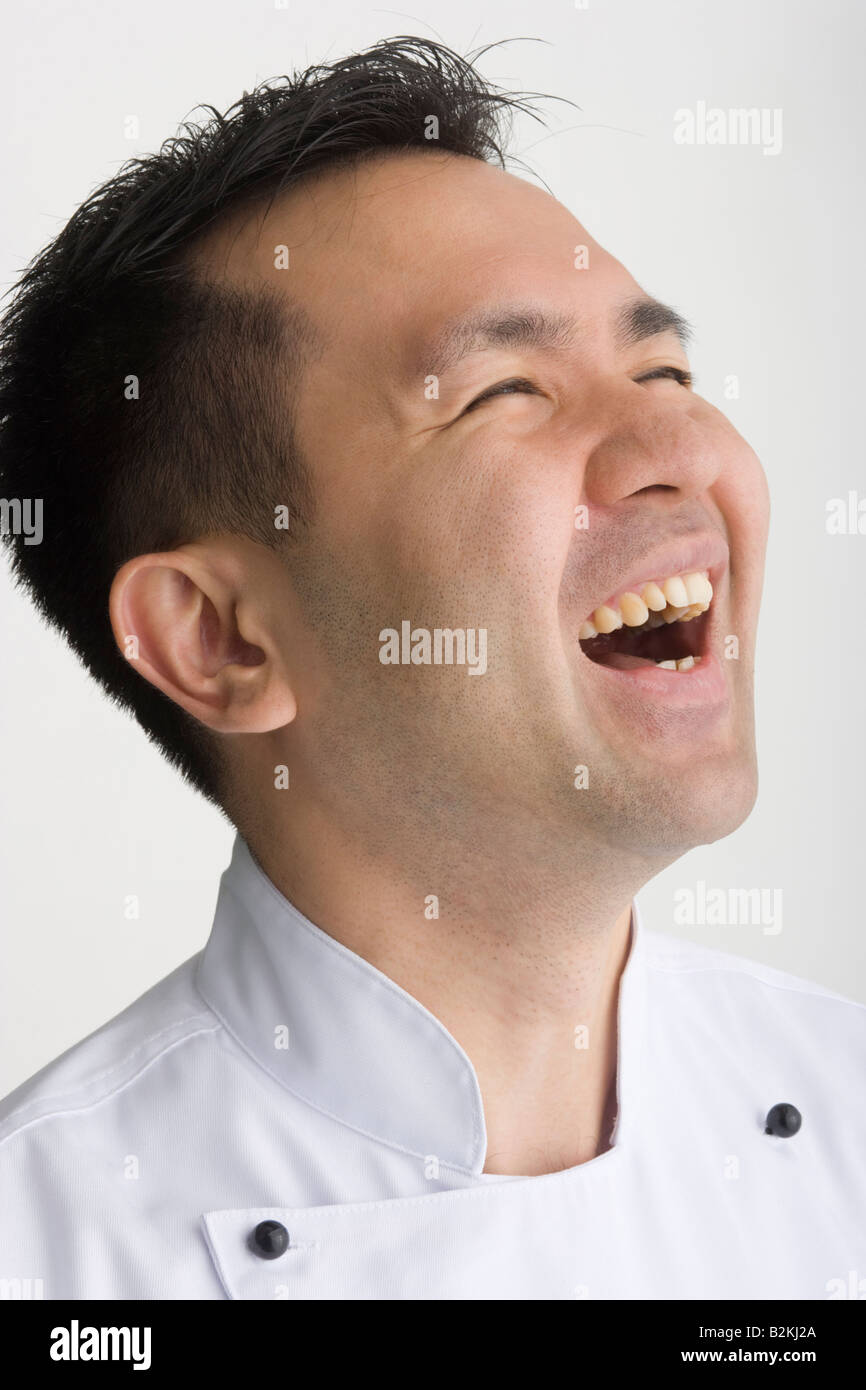 Close-up of a male chef laughing Stock Photo - Alamy