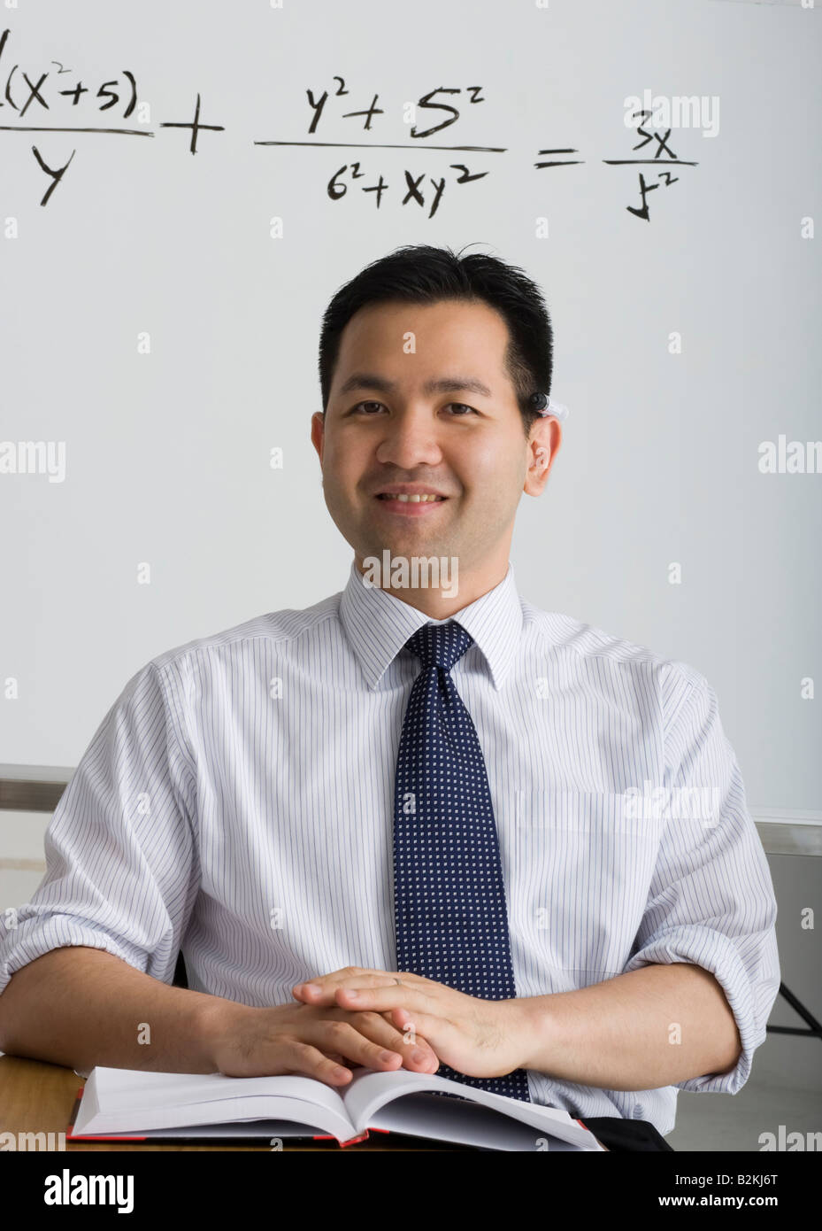 Portrait of a professor smiling Stock Photo - Alamy