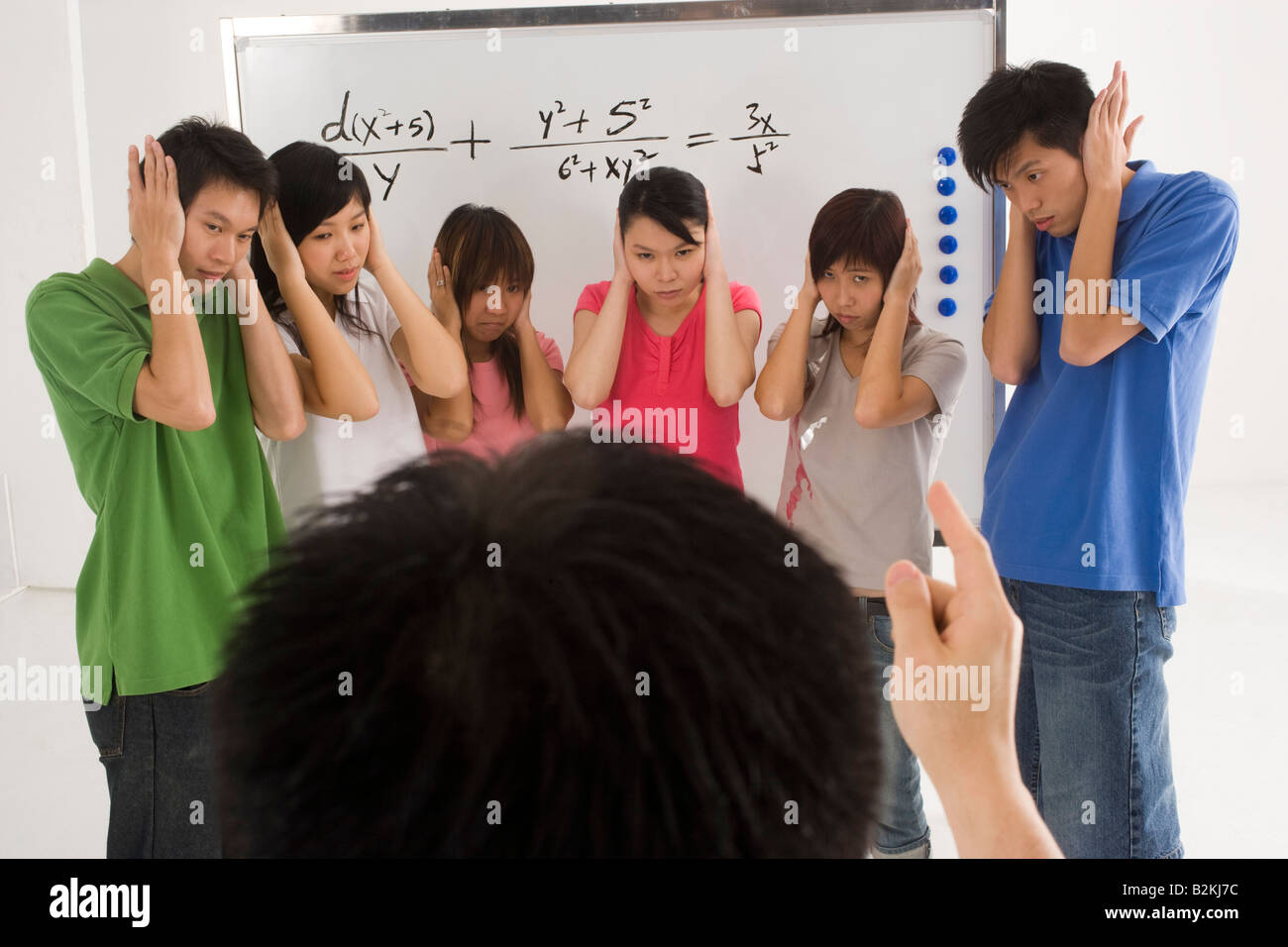 Male professor scolding students Stock Photo - Alamy