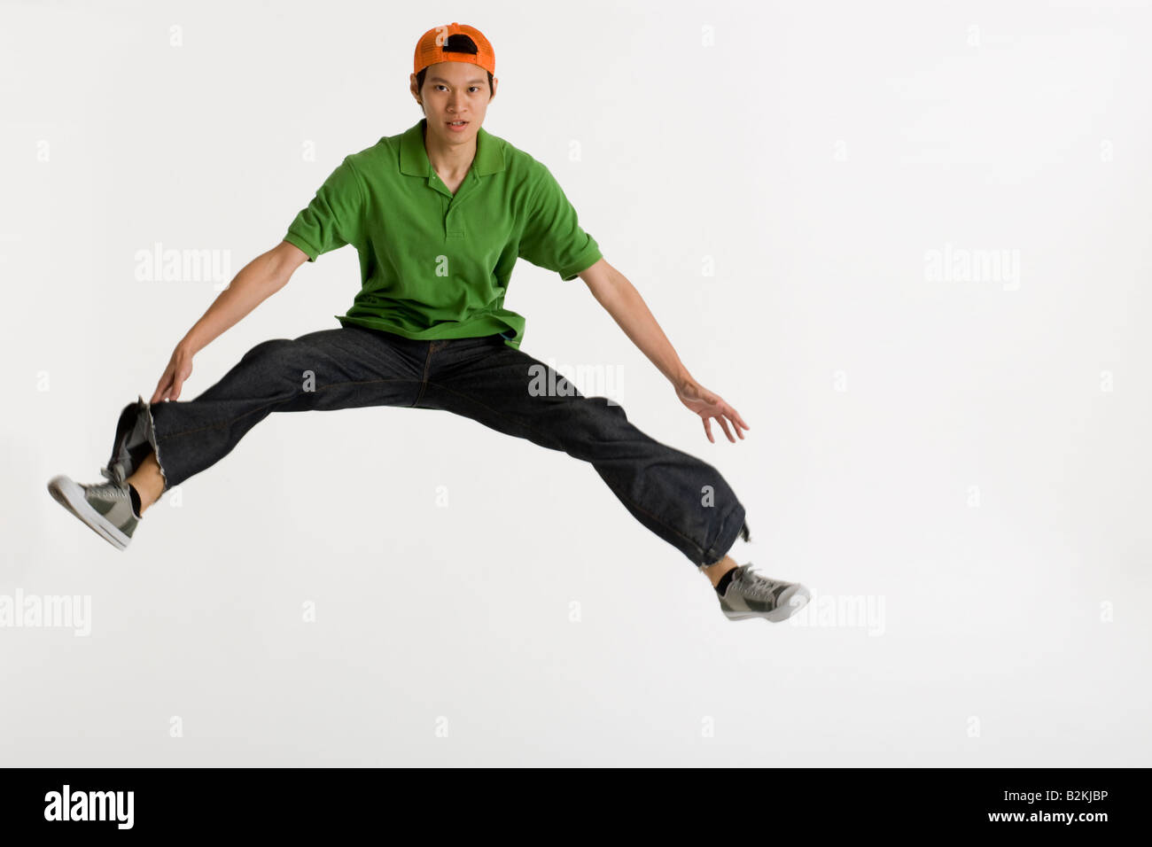 Portrait of a young man jumping Stock Photo - Alamy