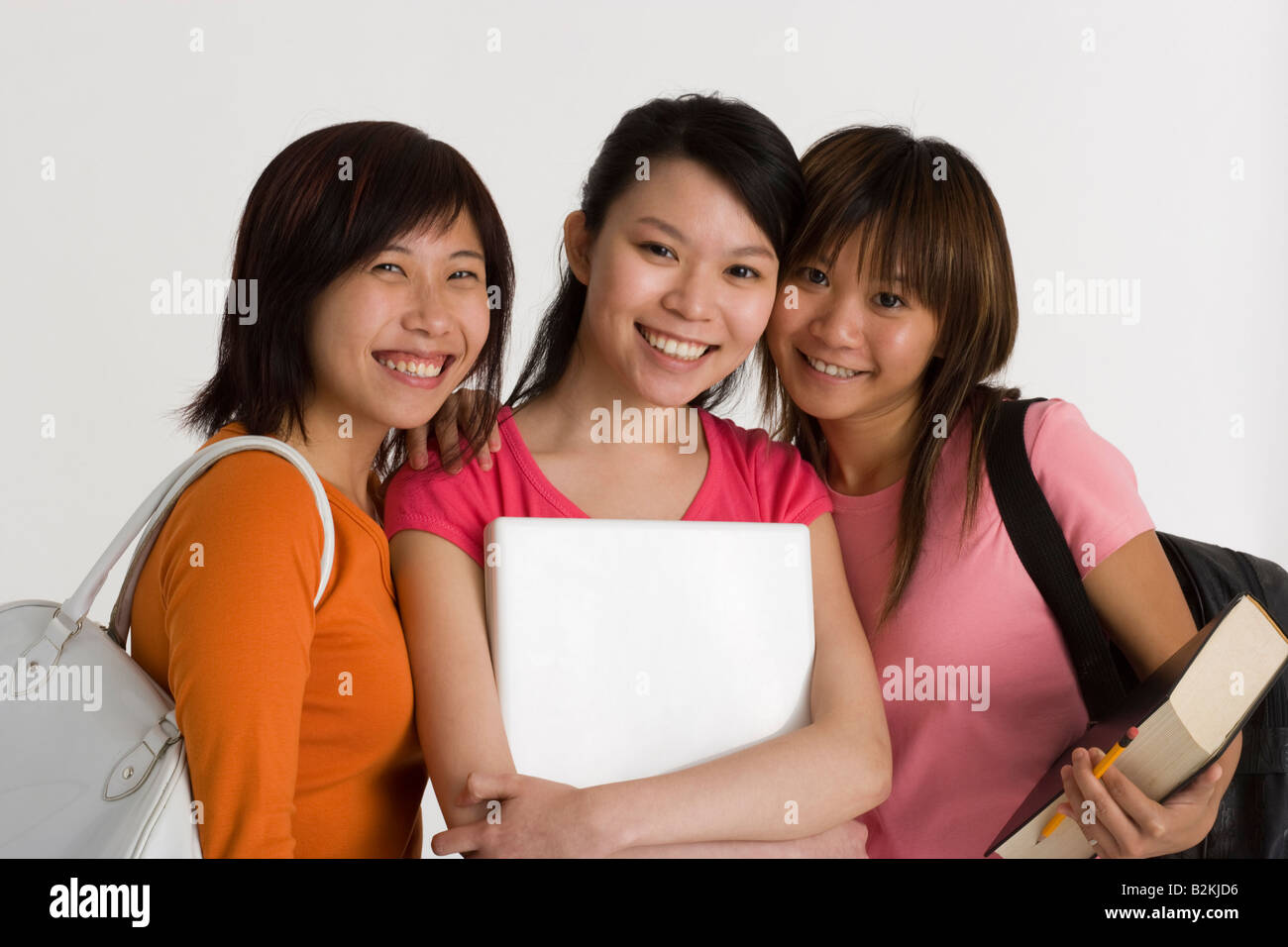 Portrait of three female university students smiling together Stock ...