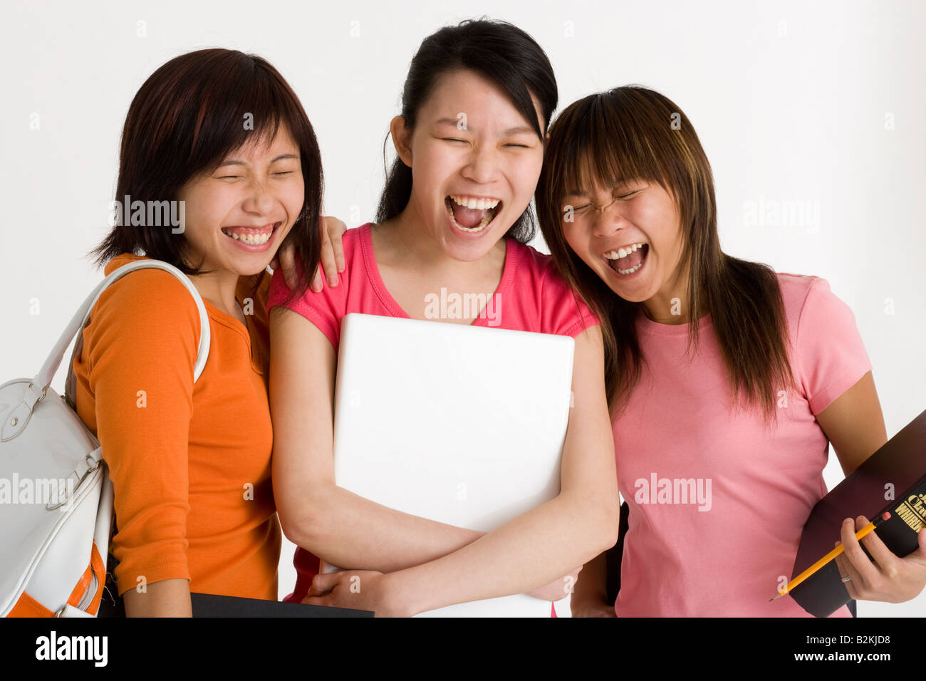 Three female university students standing together Stock Photo - Alamy