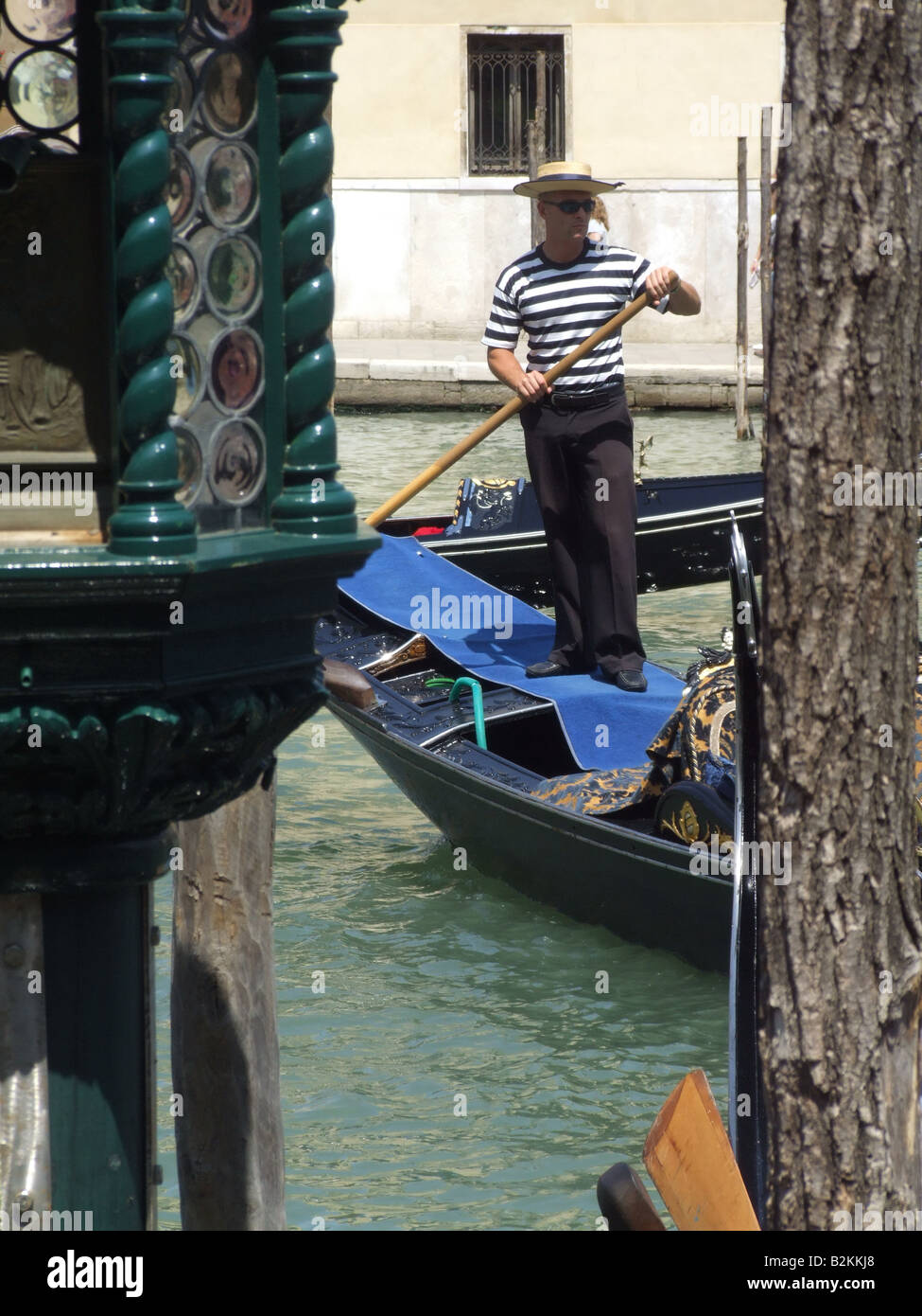 gondolier and gondola in venice italy Stock Photo - Alamy