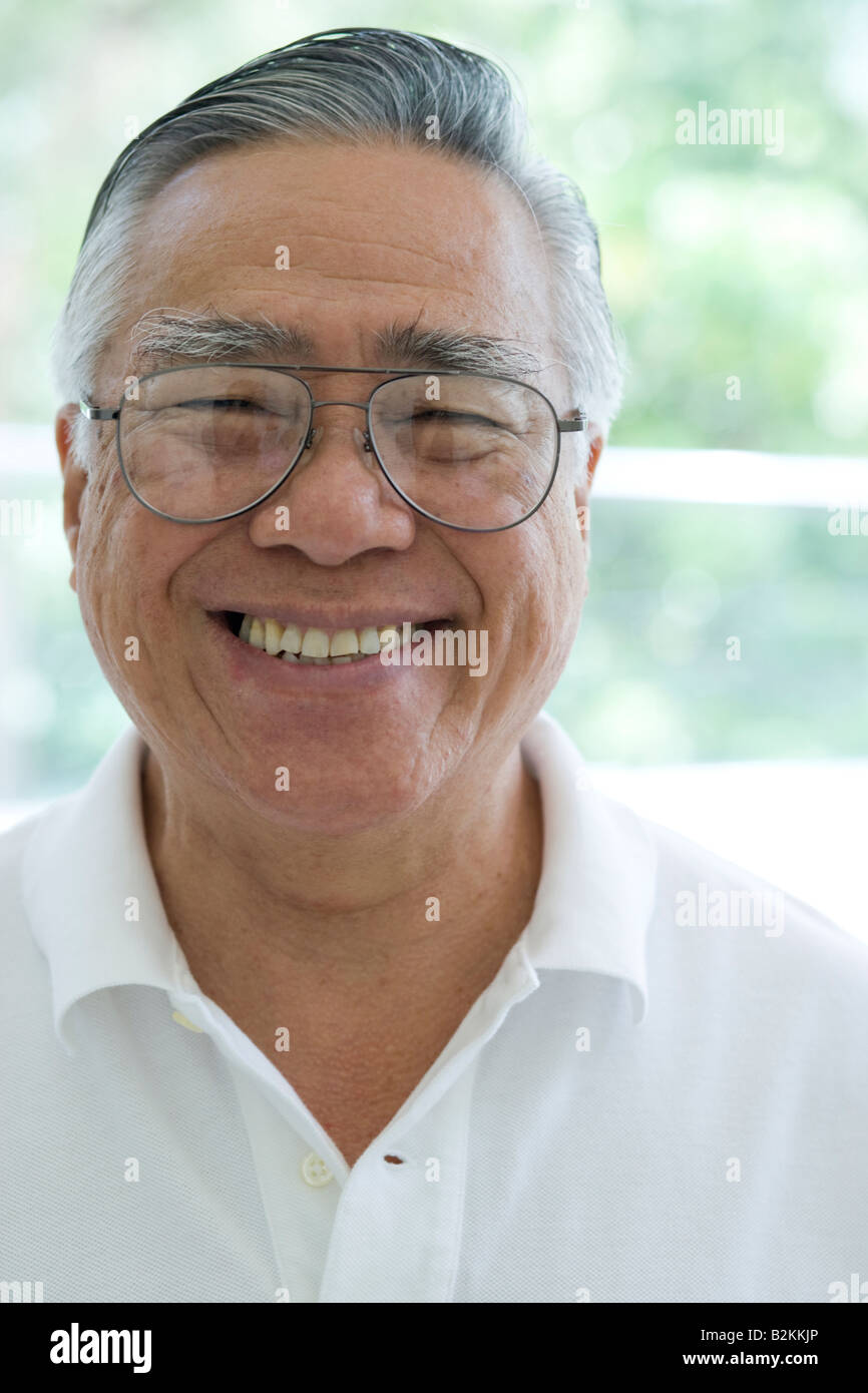 Portrait of a senior man smiling Stock Photo - Alamy