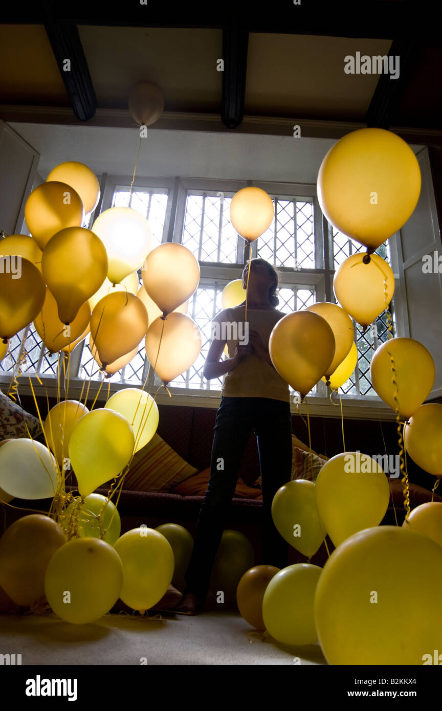 Girl yellow balloons hi-res stock photography and images - Alamy