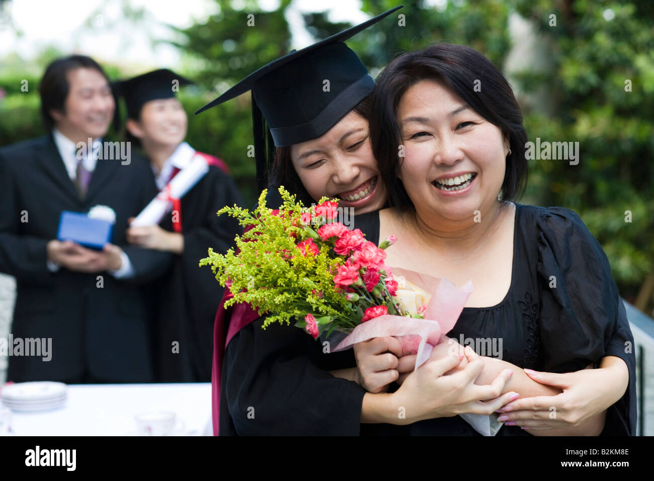 Mother father daughter graduation hi-res stock photography and images ...