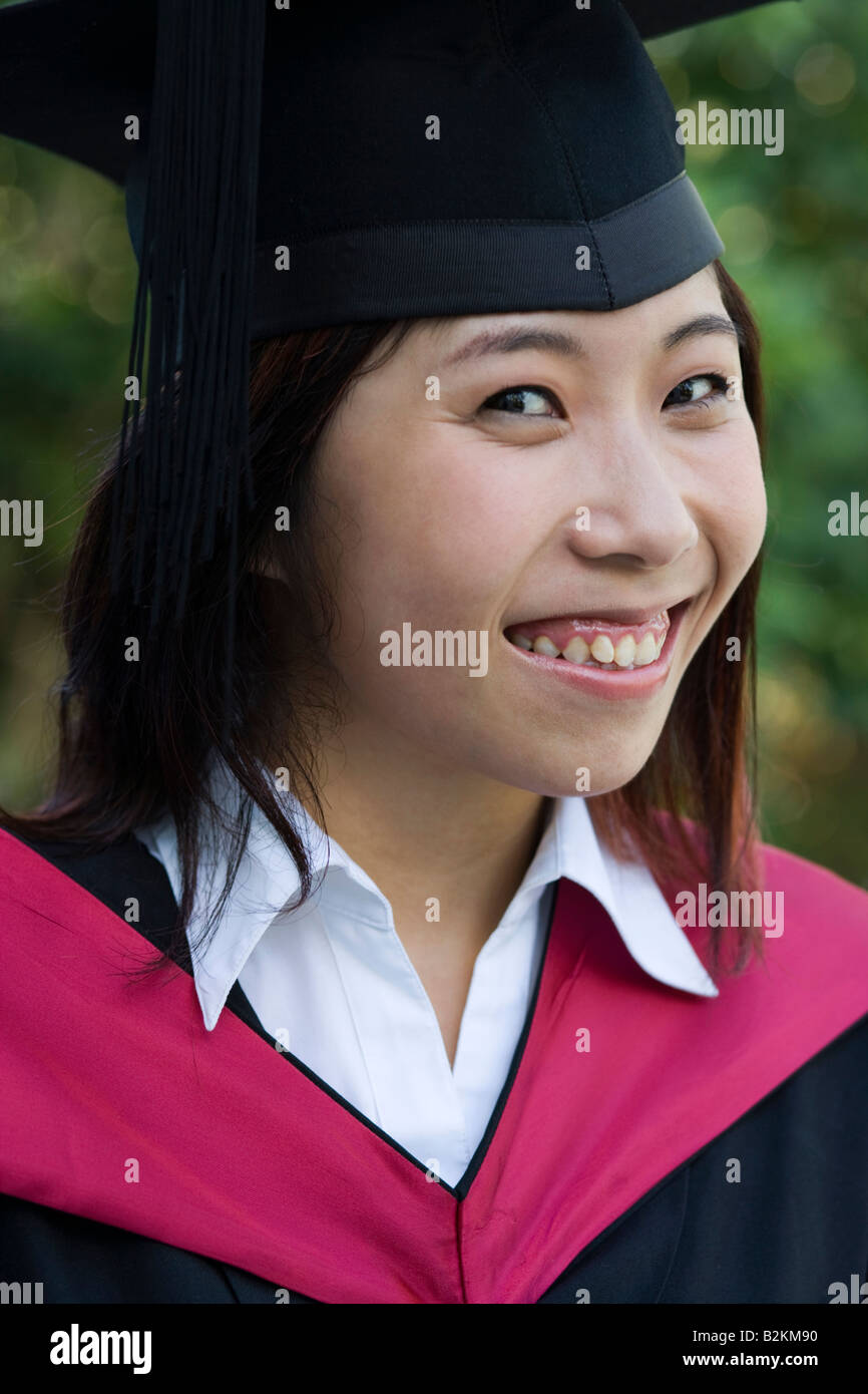 Portrait of a mid adult female graduate smiling Stock Photo - Alamy