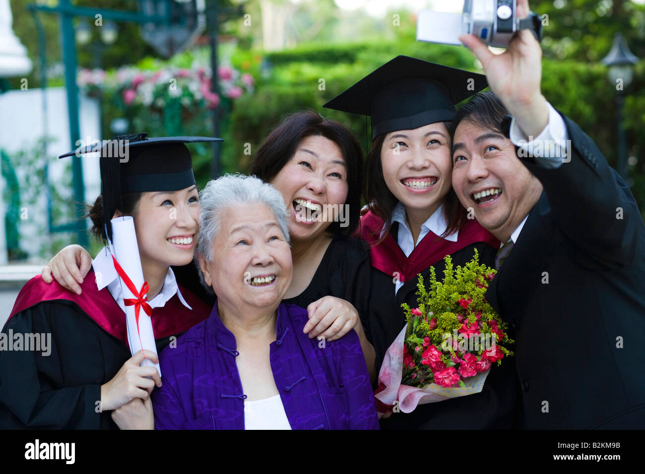 Family filming themselves with a home video camera Stock Photo - Alamy