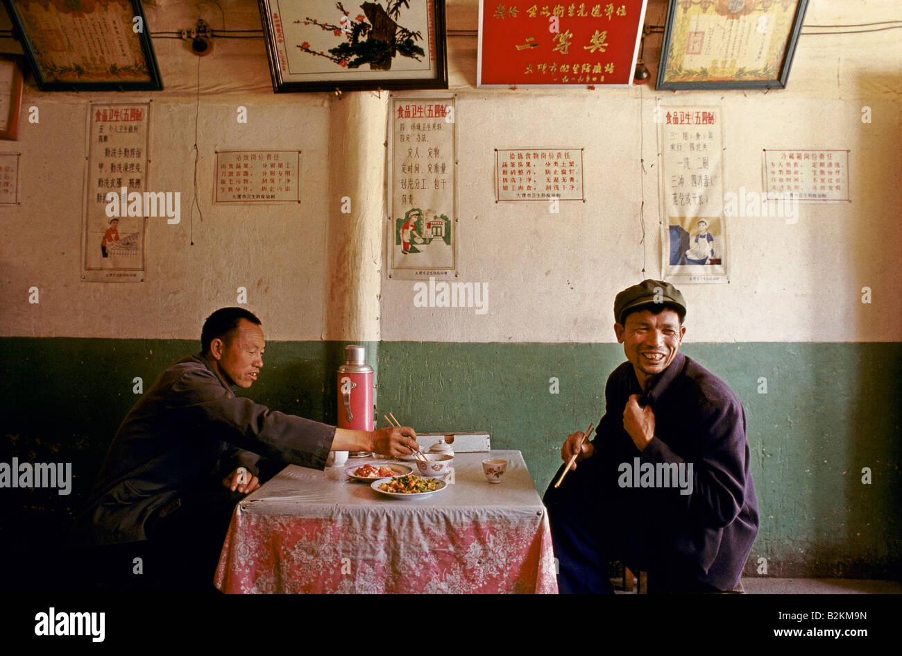 men eating china Stock Photo - Alamy