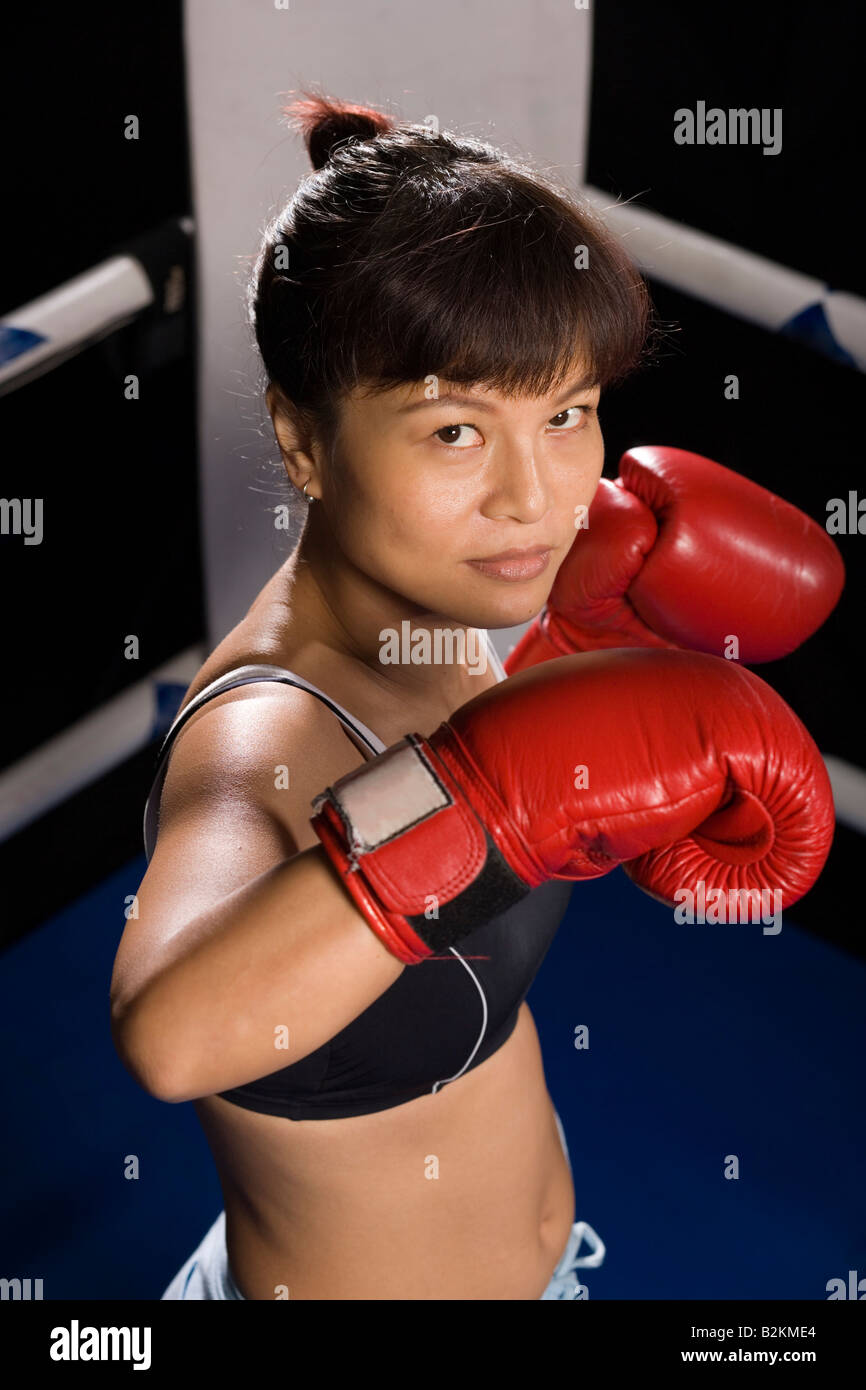 Young woman practicing boxing in a boxing ring Stock Photo - Alamy