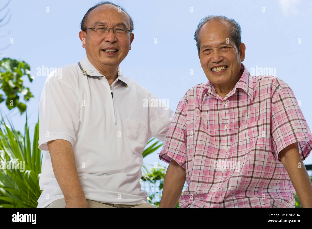 Portrait of two senior men smiling Stock Photo - Alamy