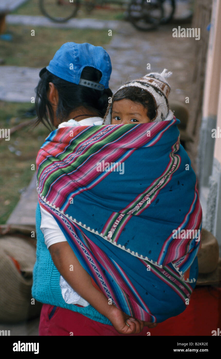 Inca woman with baby on her back near Cuzco Peru Stock Photo - Alamy
