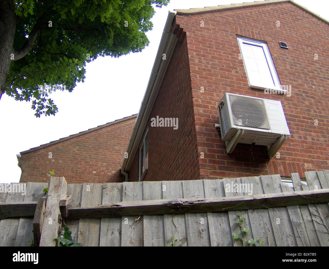 An airconditioning unit fitted to a residential house in the UK Stock ...