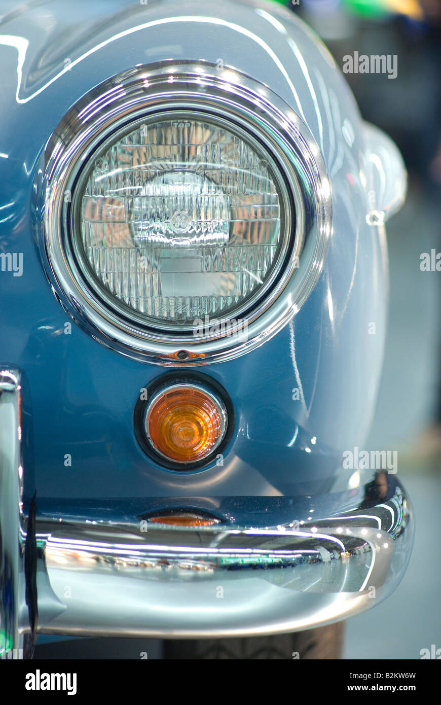 Front detail with headlight of light blue classic Mercedes Benz 190 SL ...