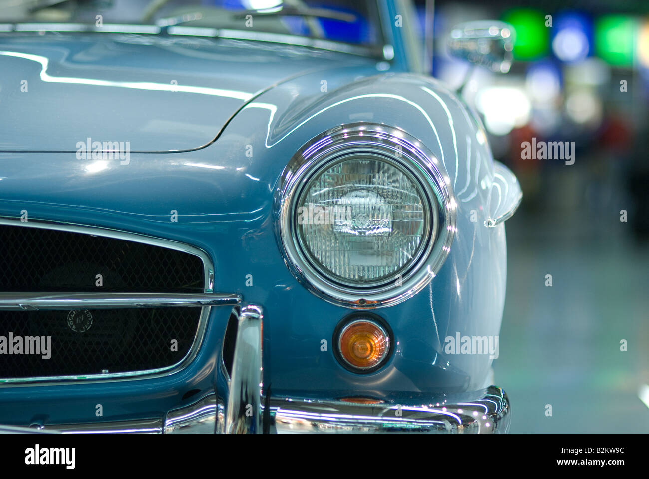 Front detail with headlight of light blue classic Mercedes Benz 190 SL ...