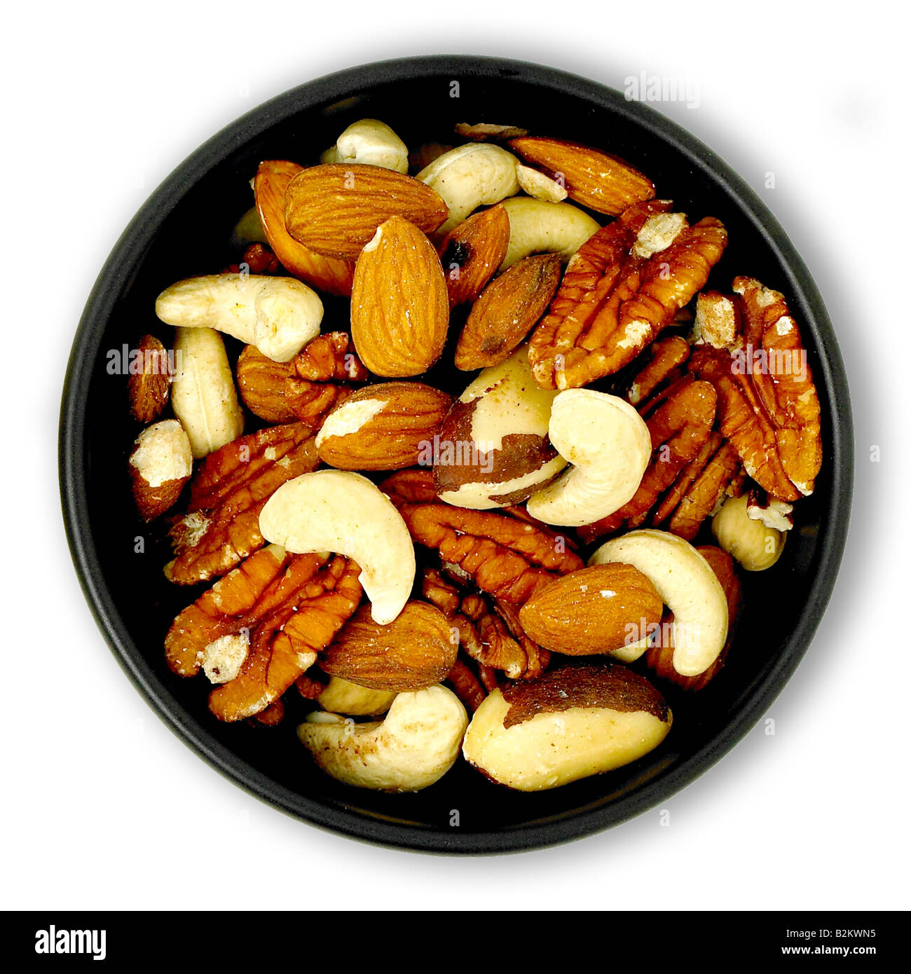 Black bowl full of nuts Stock Photo - Alamy