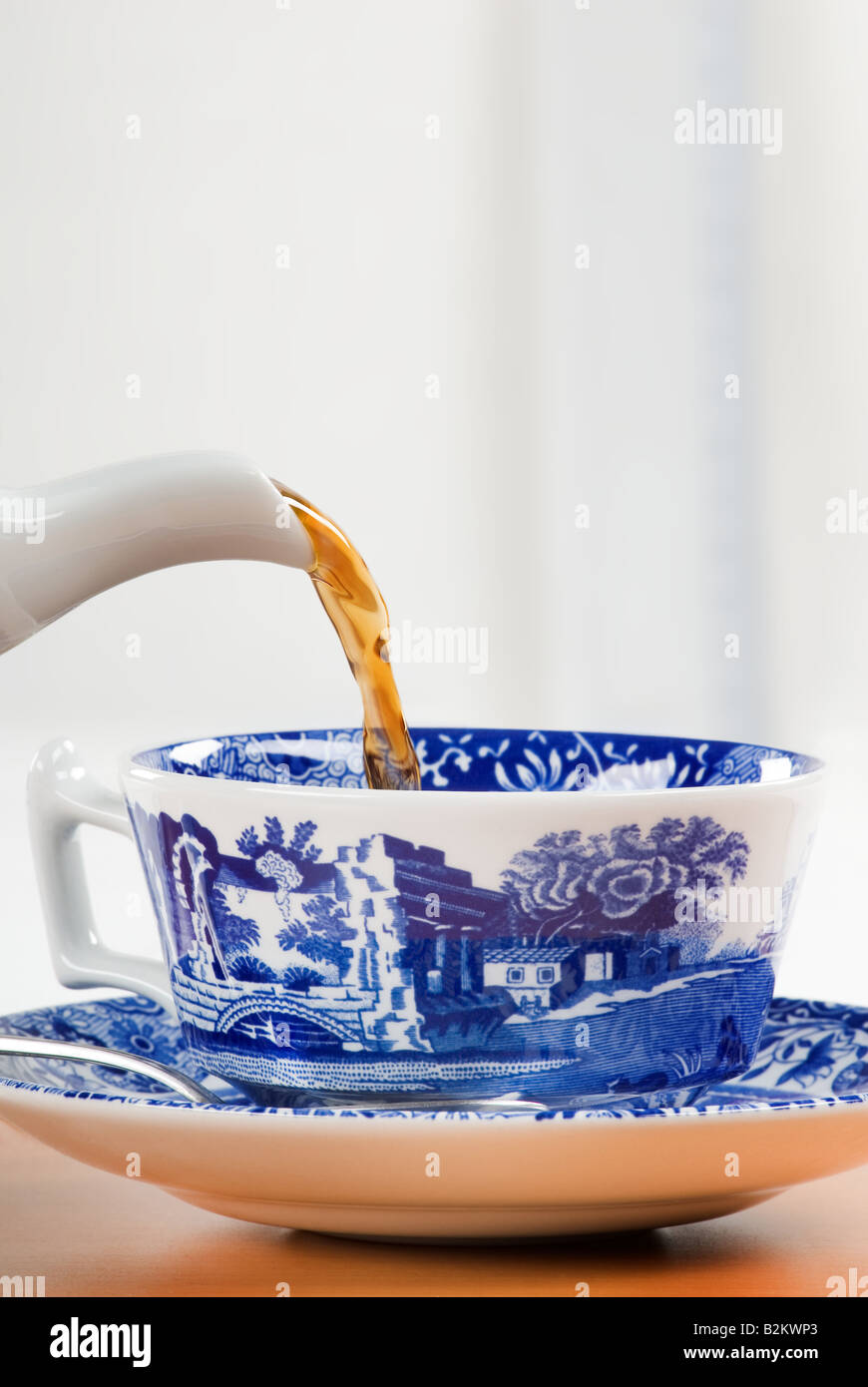 Pouring a cup of tea Stock Photo - Alamy