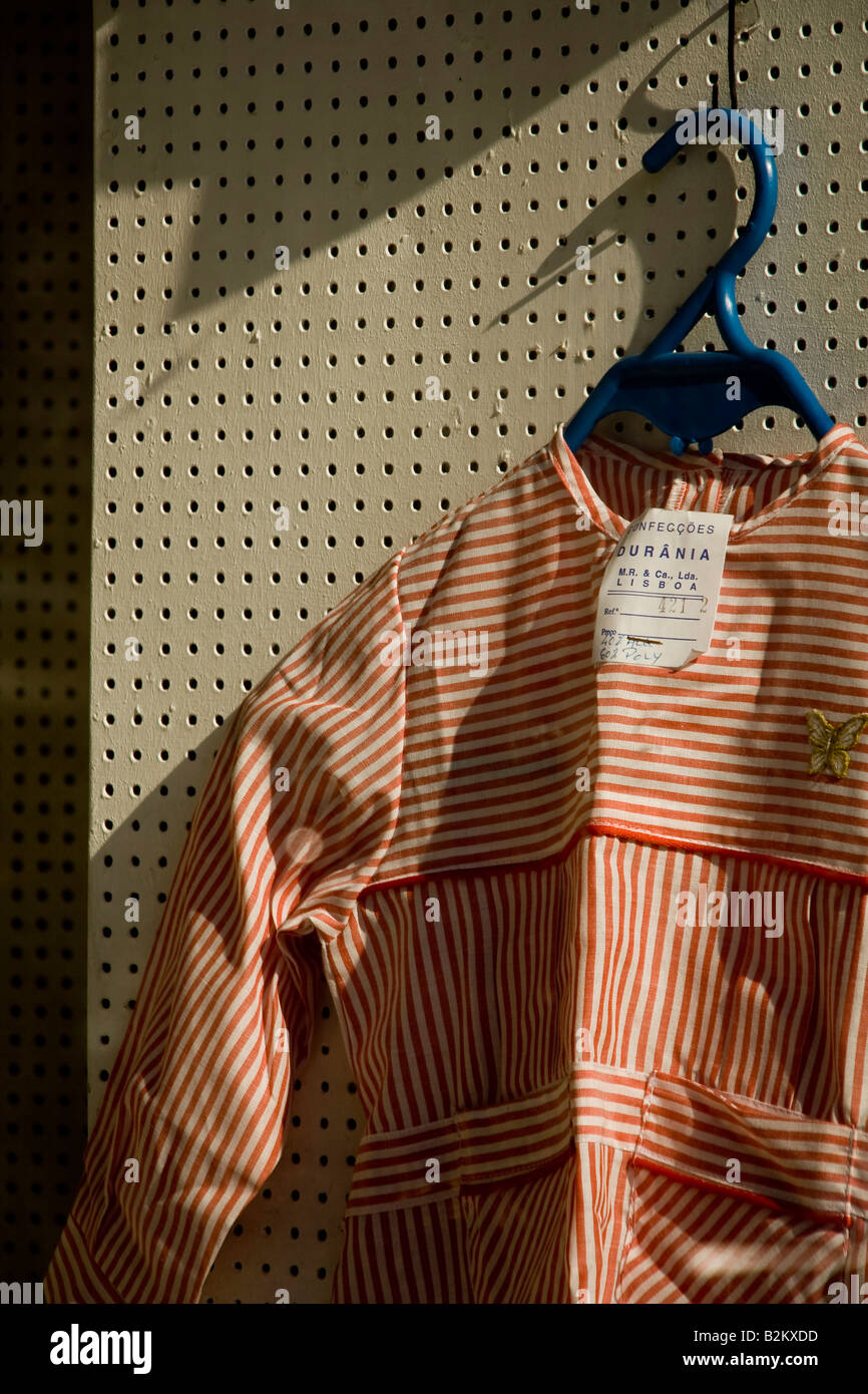 child uniform on hanger Stock Photo - Alamy
