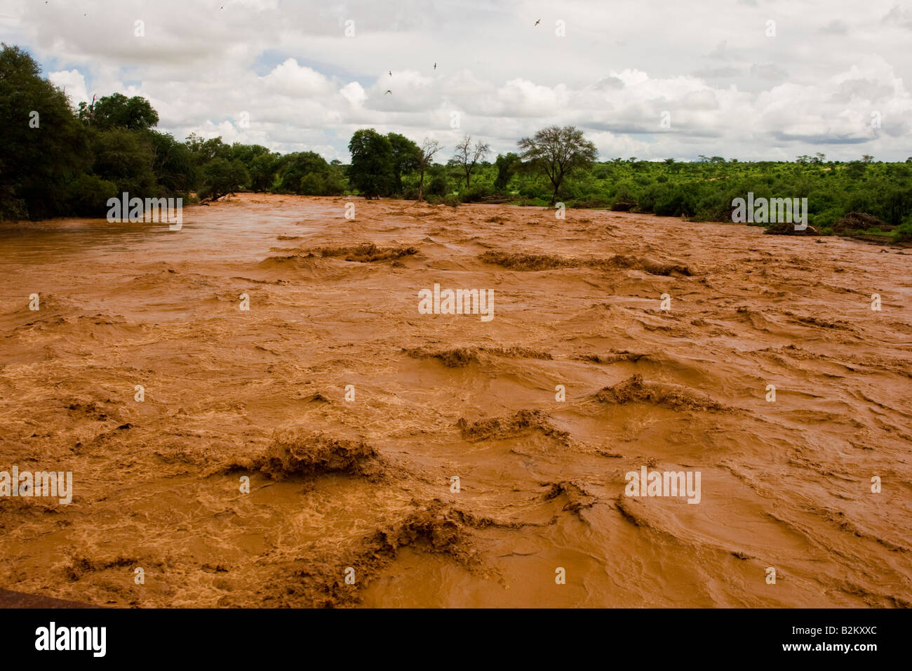 Heavy rains and red clay produce a raging red river in Samburu Stock ...