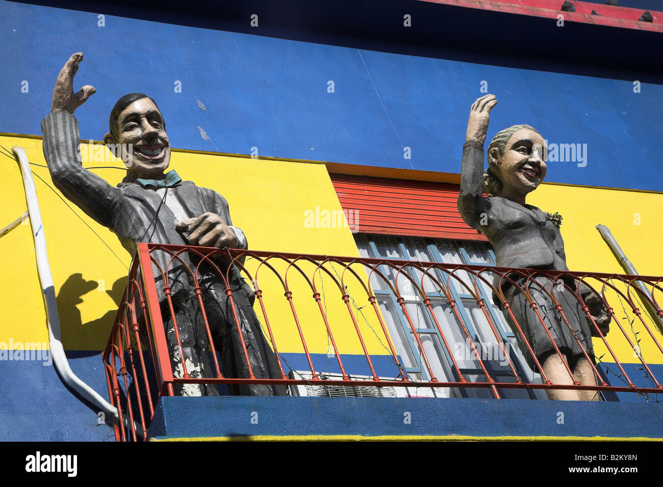 Models of Juan Peron and Eva Peron leaning from one of the colourful ...