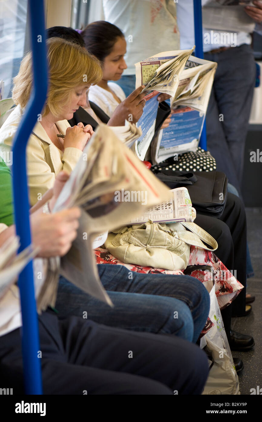 London underground tube newspaper hi-res stock photography and images ...